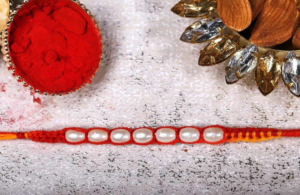 Buy Pearls Rakhi Online | The Desi Food | Free Shipping